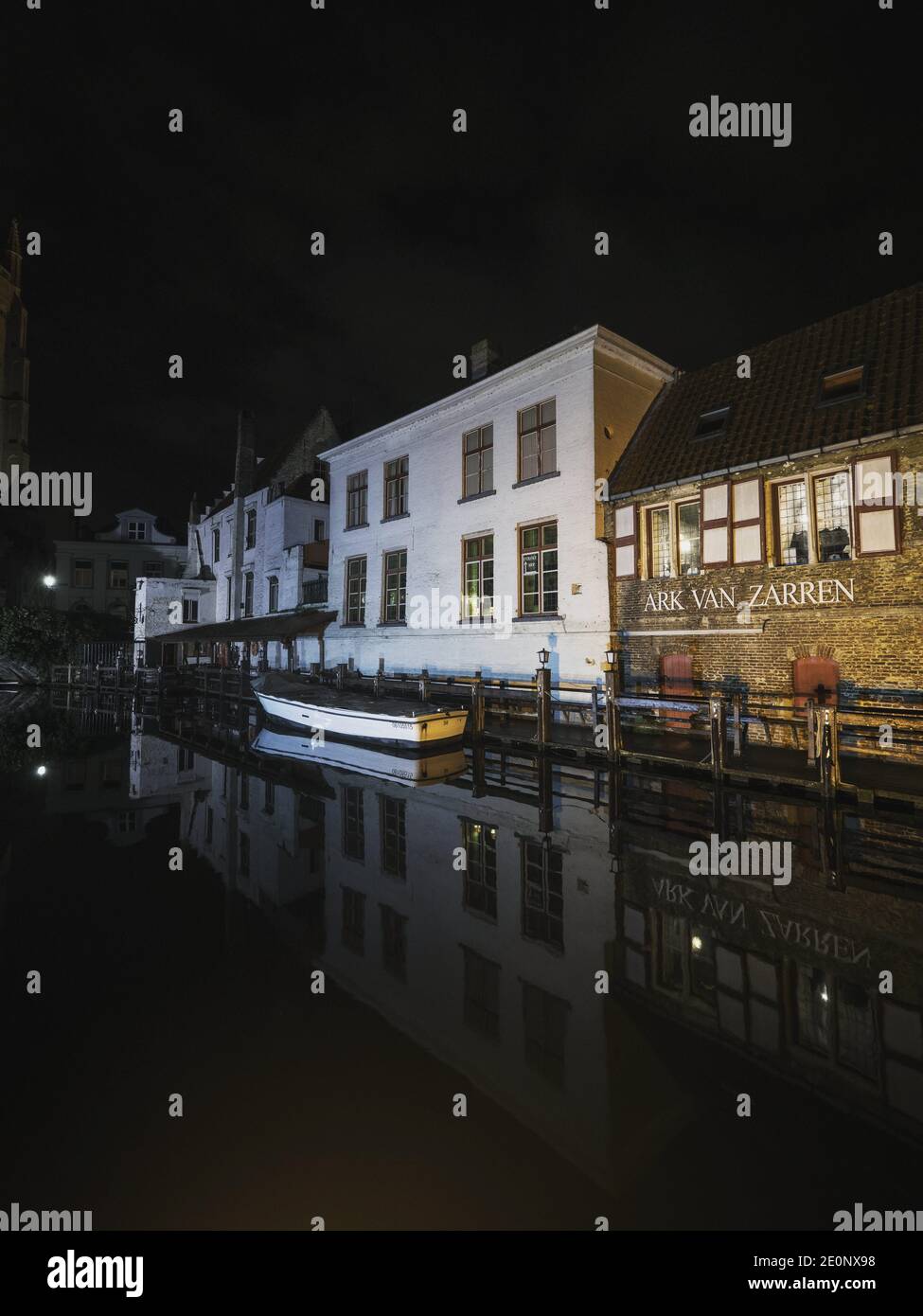 Night view of illuminated buildings in Bruges canals historical city ...