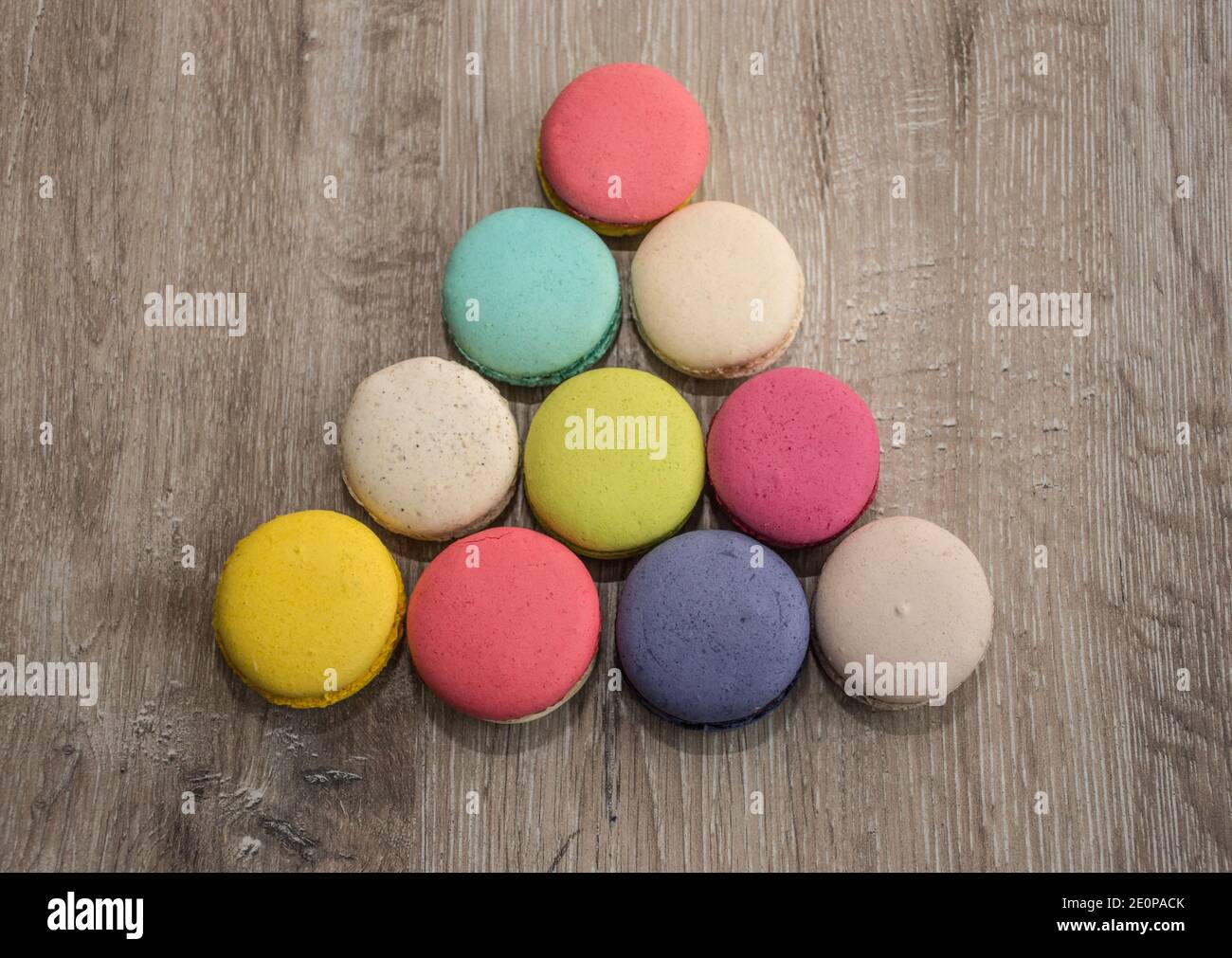 closeup row of macaroons on a wooden surface Stock Photo - Alamy