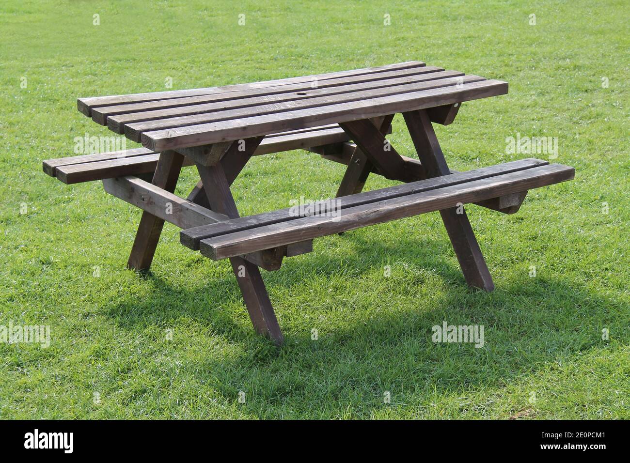 A Traditional Outdoor Wooden Picnic Table with Seats Stock Photo - Alamy