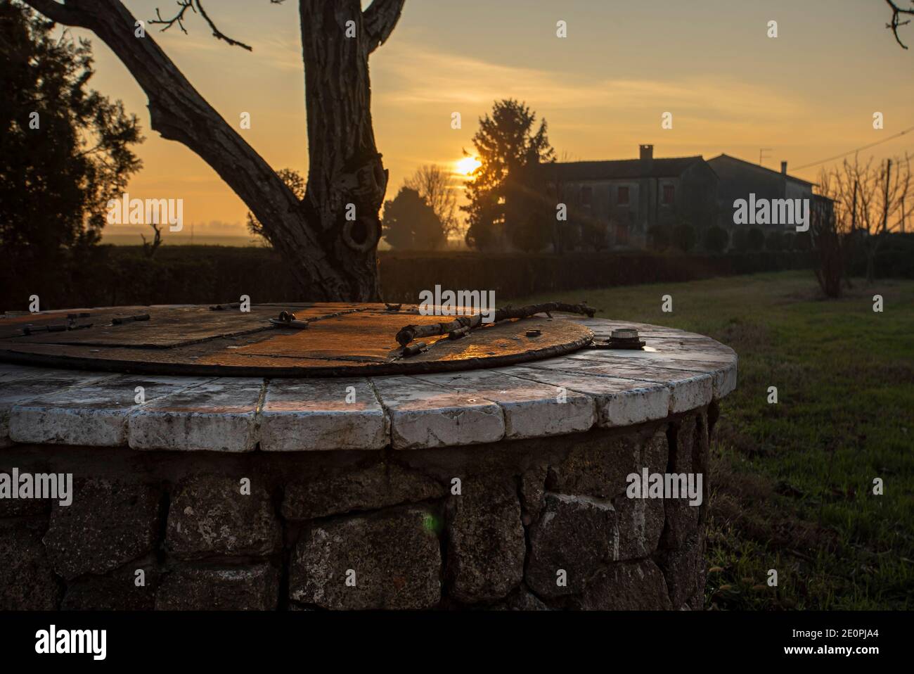 Water Well immersed in a countryside landscape at sunset time Stock ...