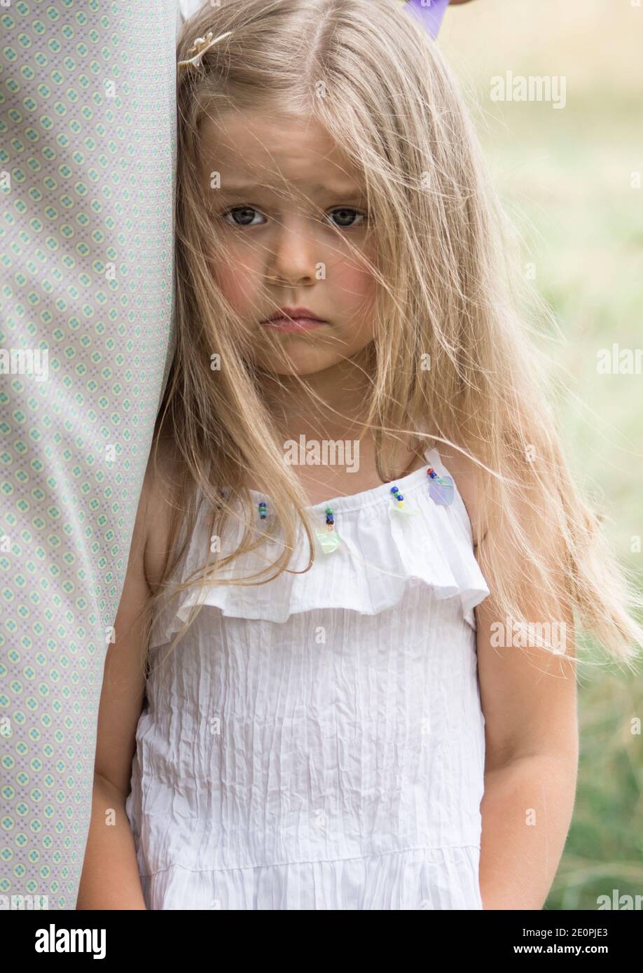 Sad girl child behind hi-res stock photography and images - Alamy
