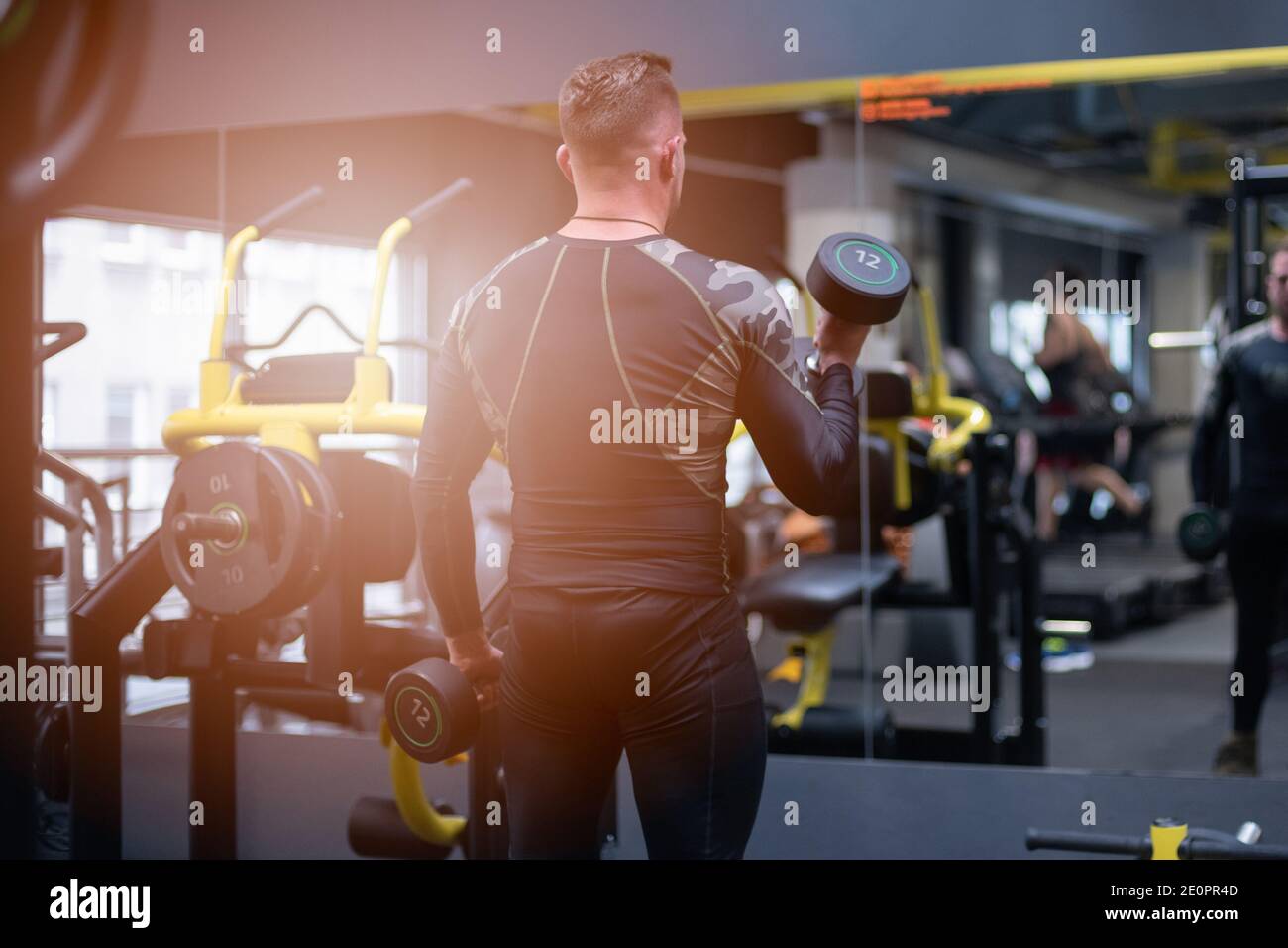 Male athlete is working out at the gym in front of the mirror Stock ...