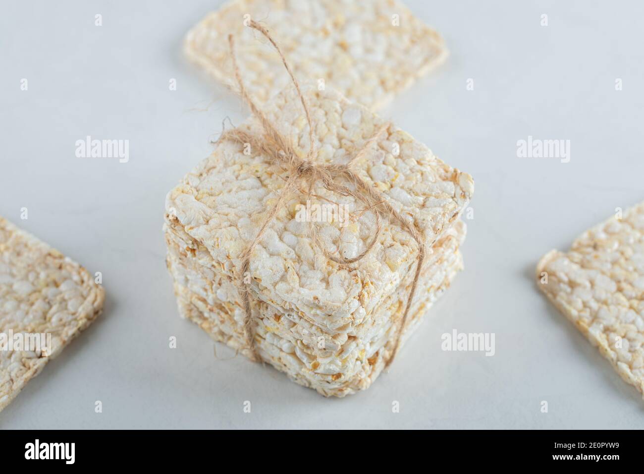 Stack of delicious airy crispbread on white background Stock Photo - Alamy