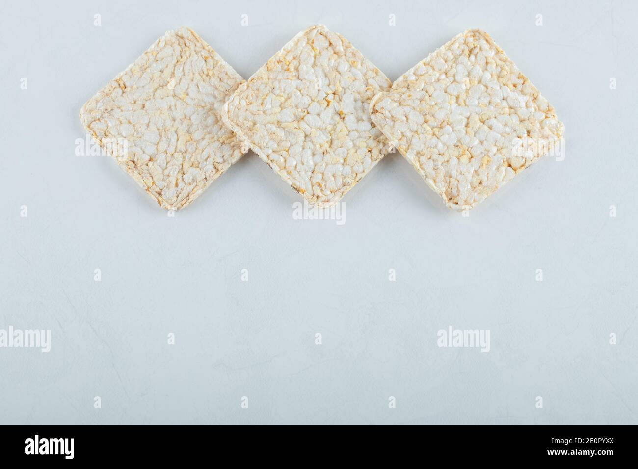Delicious airy crispbread on white background Stock Photo - Alamy
