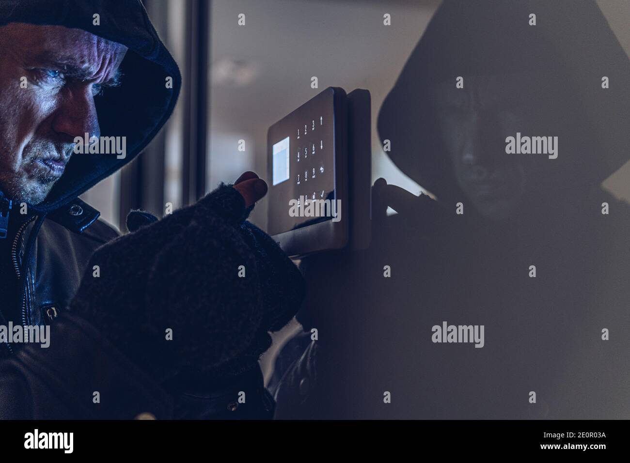 Thief tries disarm alarm hi-res stock photography and images - Alamy