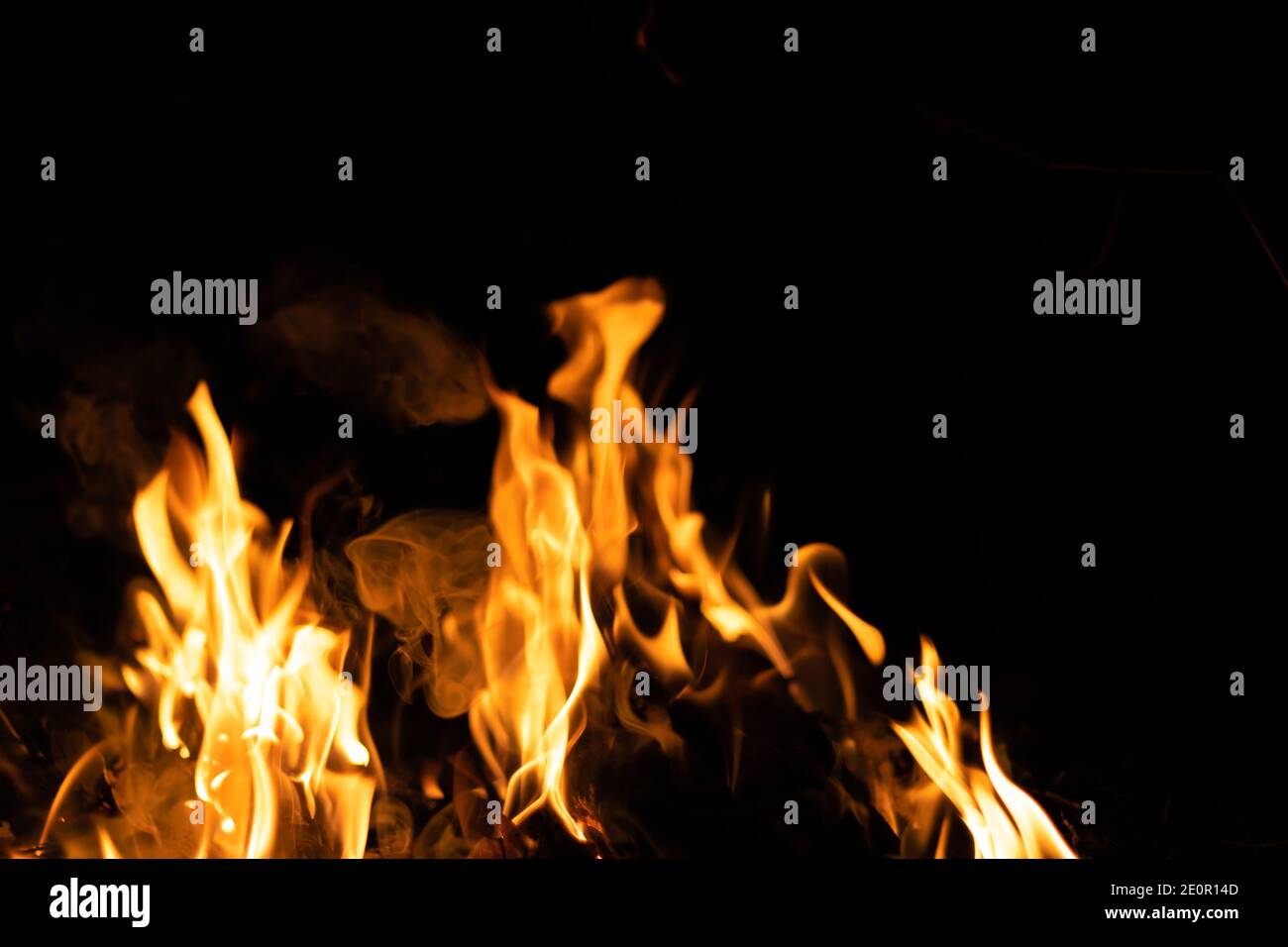 Fire flames on a black background. Abstract fiery texture. Realistic ...