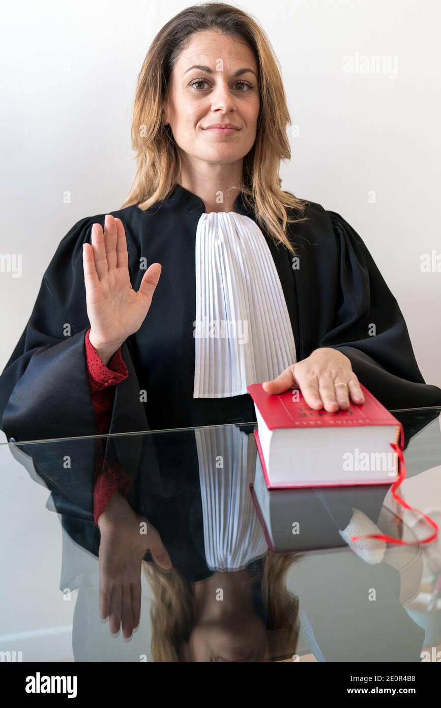 Justice, lawyer woman raising your hand to swear with a smile Stock ...