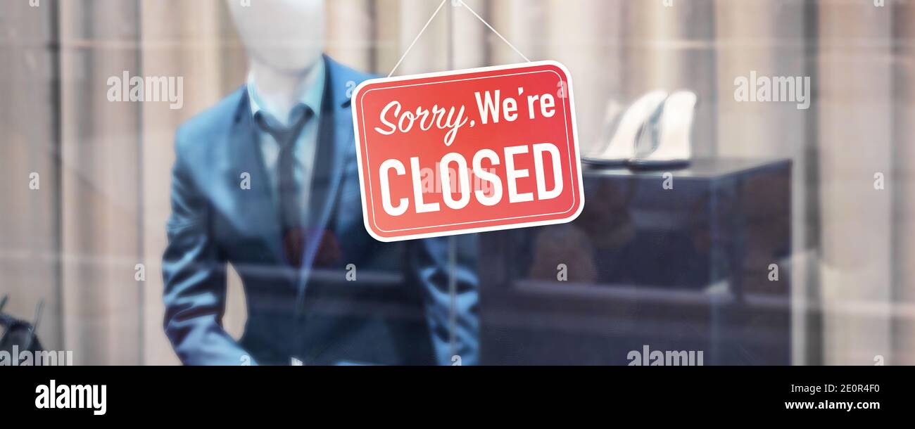 Closed shop with red message on window "Sorry we're closed" - Banner ...
