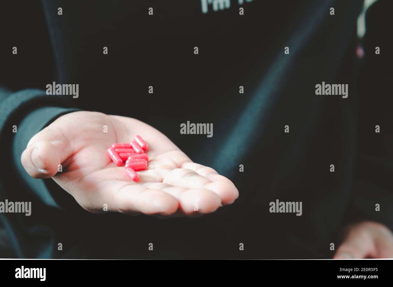 close up of the red capsule of antibiotics in hand Stock Photo - Alamy