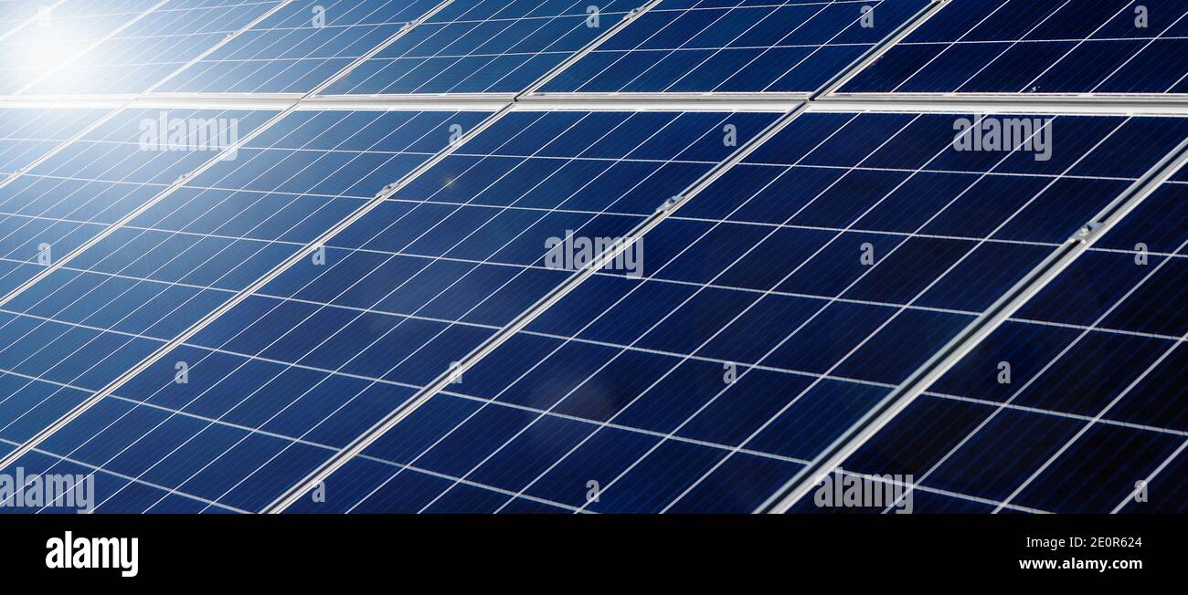 solar panels with sun flare on- Alternative energy concept - horizontal ...