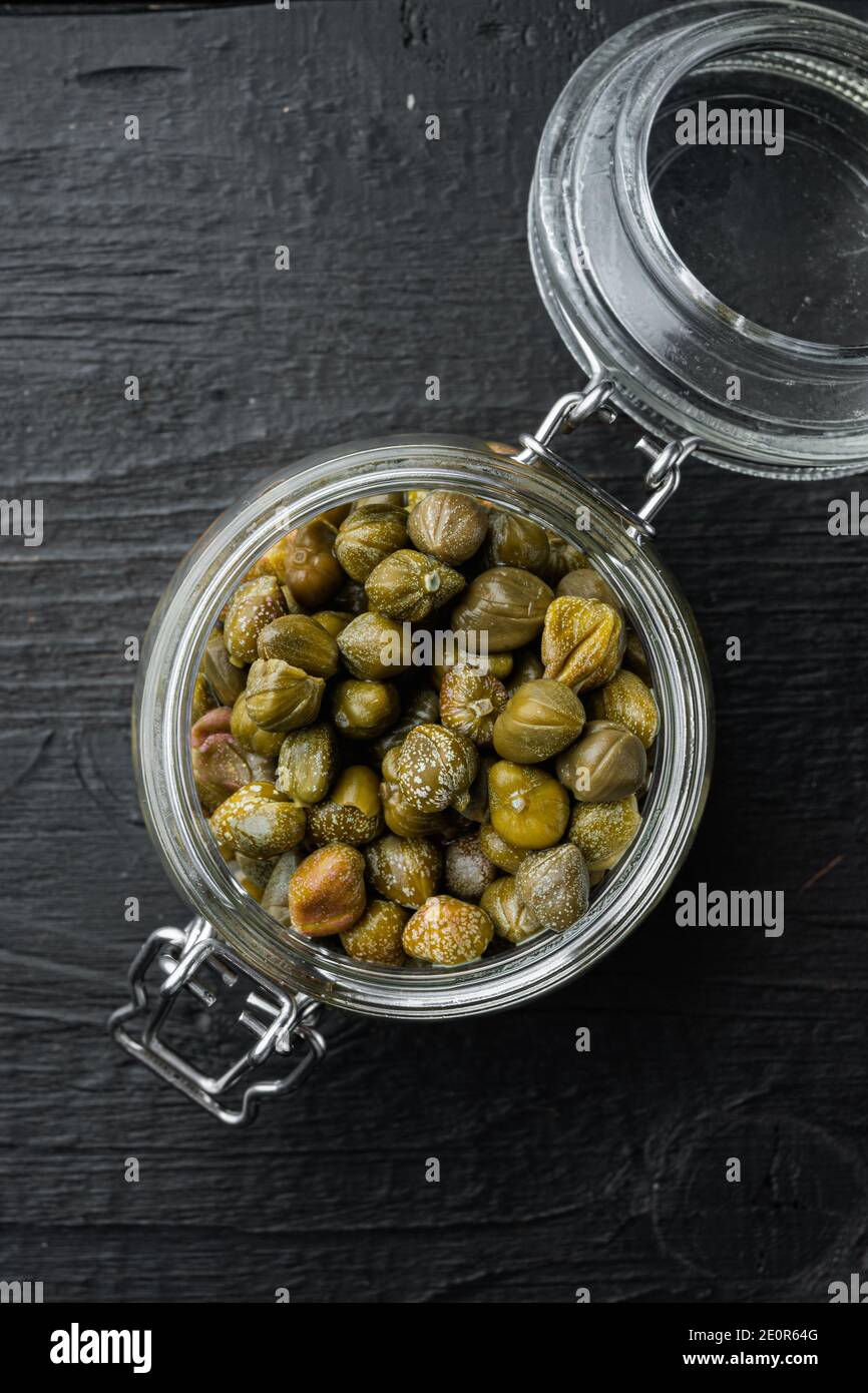 Baby capers in marinates glass jar, flat lay Stock Photo - Alamy
