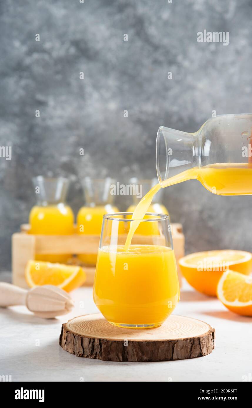Pouring orange juice bottle pouring hi-res stock photography and images ...