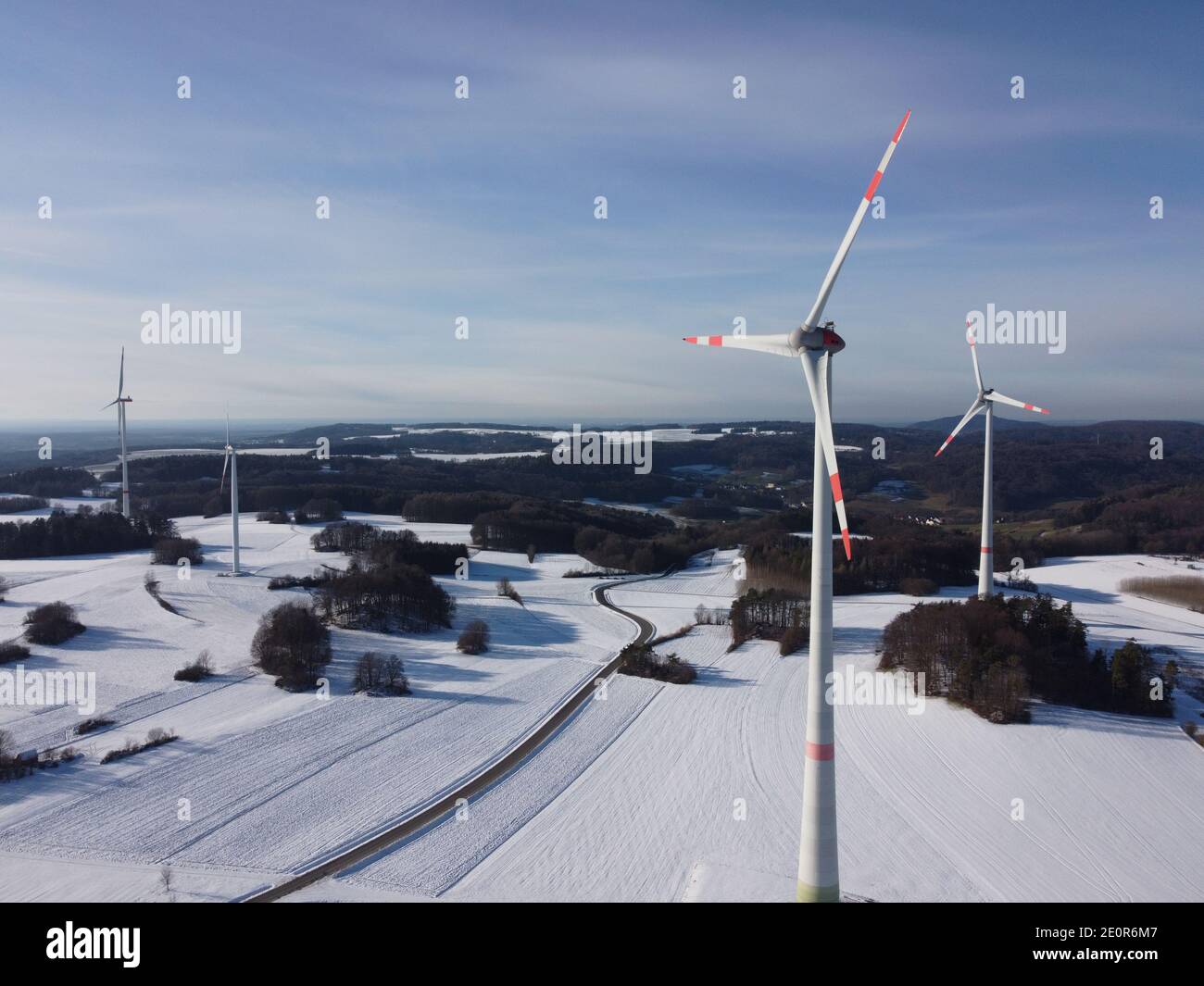 Aerial view of a wind farm in winter. Aerial view of wind turbines on a ...