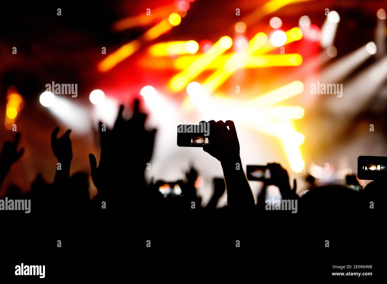 Hands and smartphones in front of the stage. Crowd at a concert Stock ...