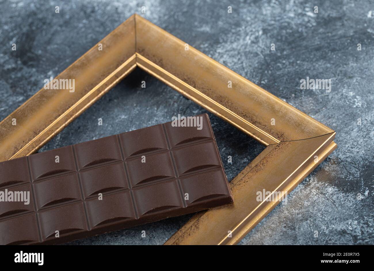 Bar of dark chocolate in a frame Stock Photo - Alamy
