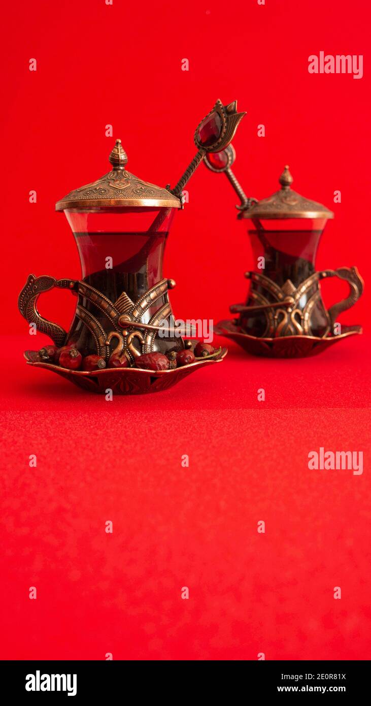 Traditional Muslim cups of tea on a red background Stock Photo - Alamy