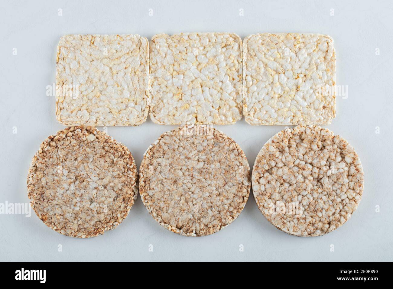 Two types of crispbread on white background Stock Photo - Alamy