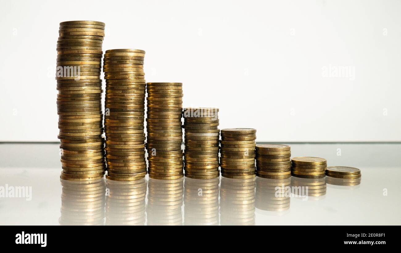 Stacks of coins and its reflexes Stock Photo - Alamy