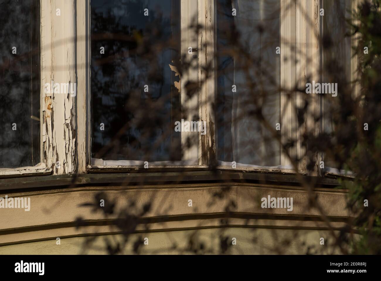 Entrance doors, broken and rotten windows and balconies from old ...