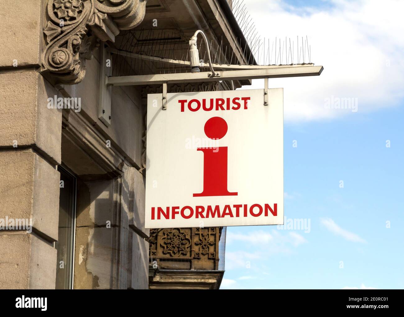 sign indicating tourist office with symbol for information is also ...