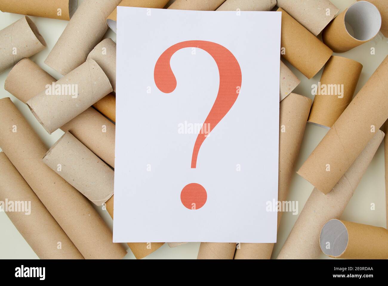 flat lay with toilet paper tubes, paper sheet and question mark Stock ...