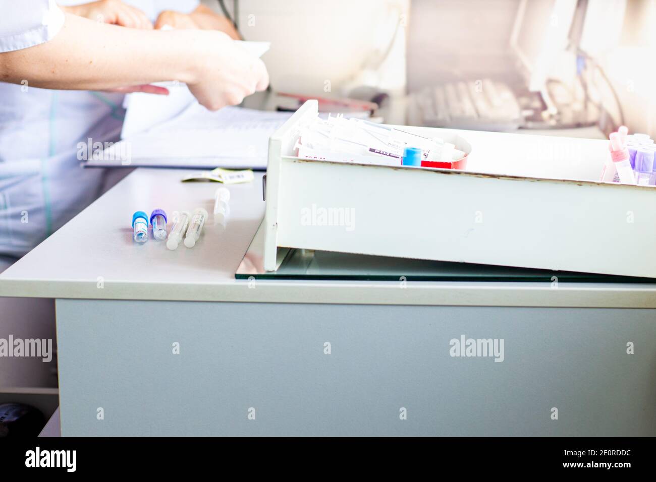 On the table are medical test tubes for blood sampling, work in the ...