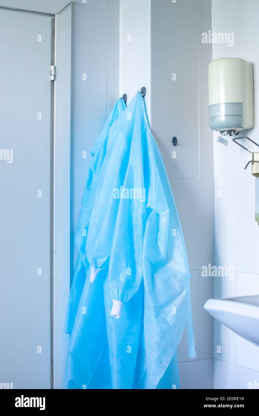 medical protective gowns hang on a hanger in a hospital, prevention ...