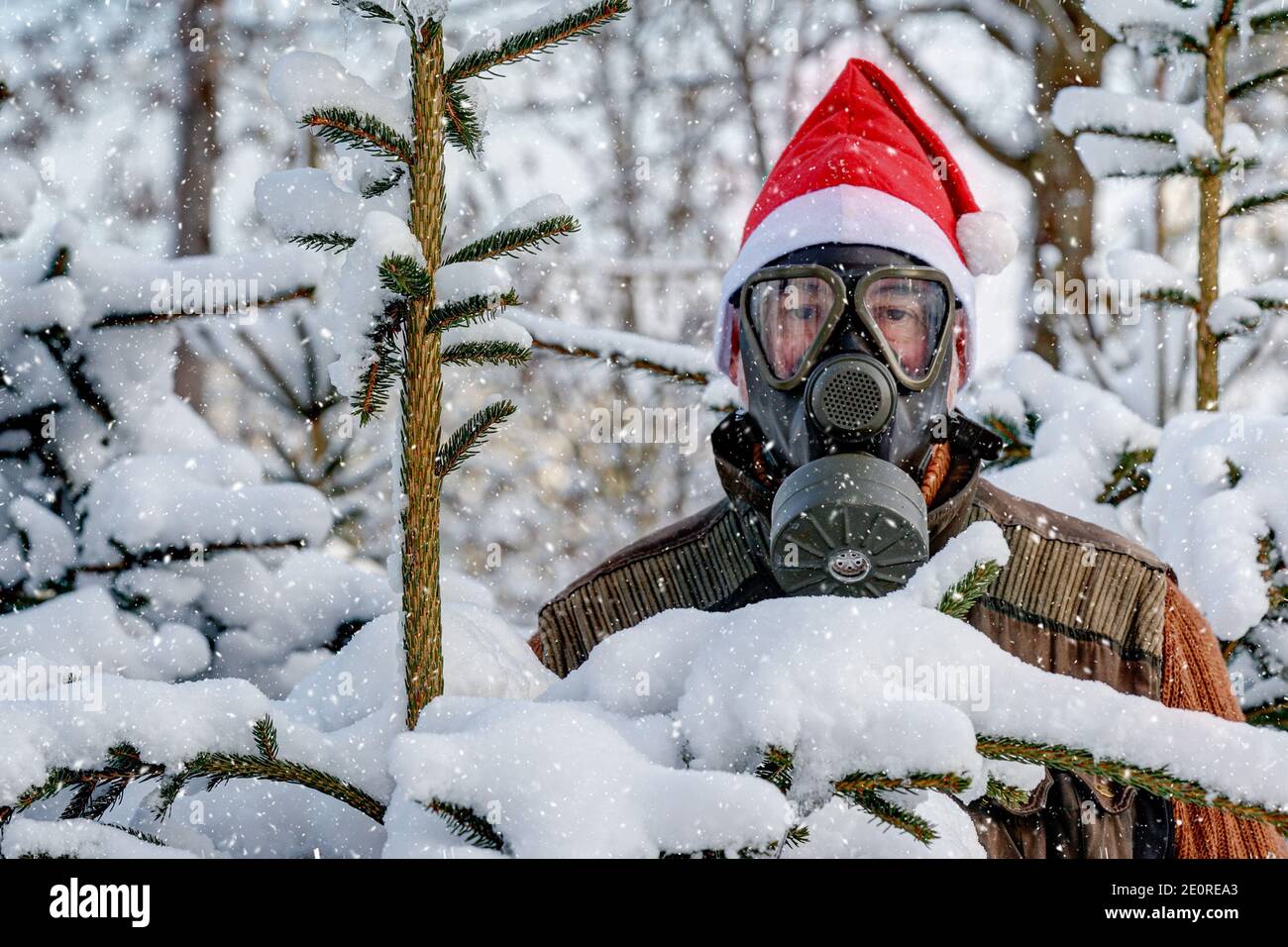 Santa Claus also wears a mask..A man with a gas mask and a red Santa ...