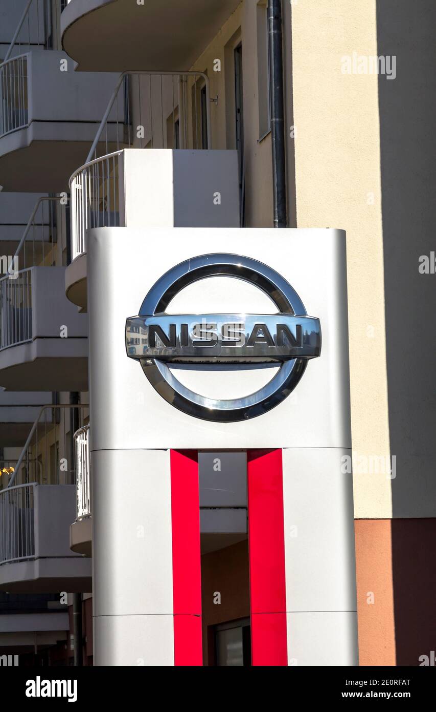 Nuremberg, GERMANY: Nissan dealership sign against blue sky. Nissan is ...