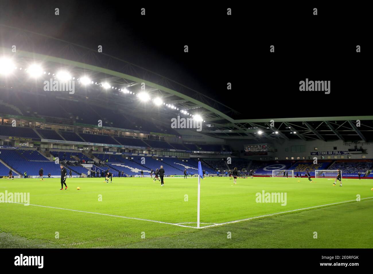 Players warm up before the Premier League match at the AMEX Stadium ...