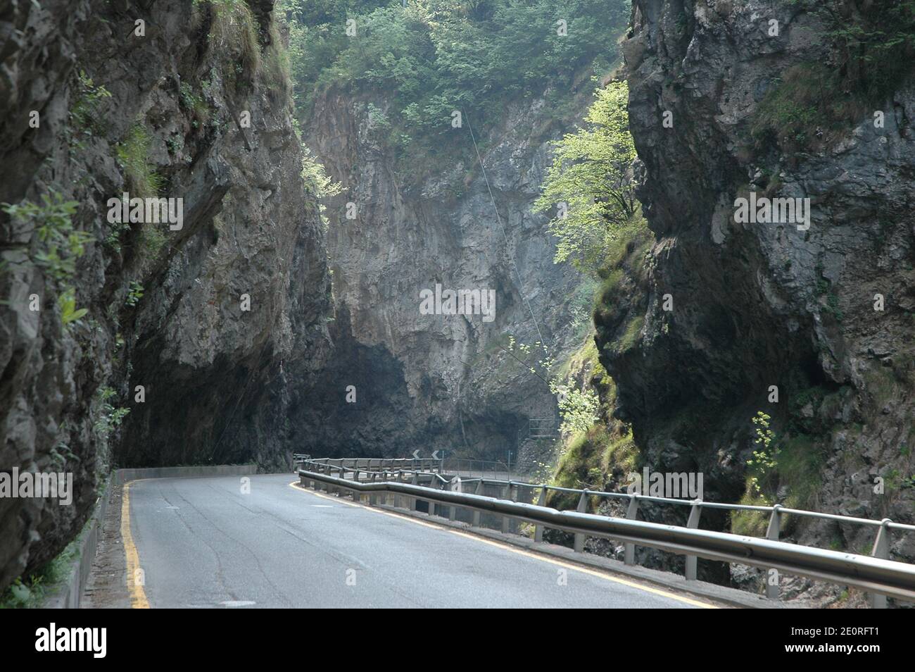 dangerous road between the rocks Stock Photo - Alamy
