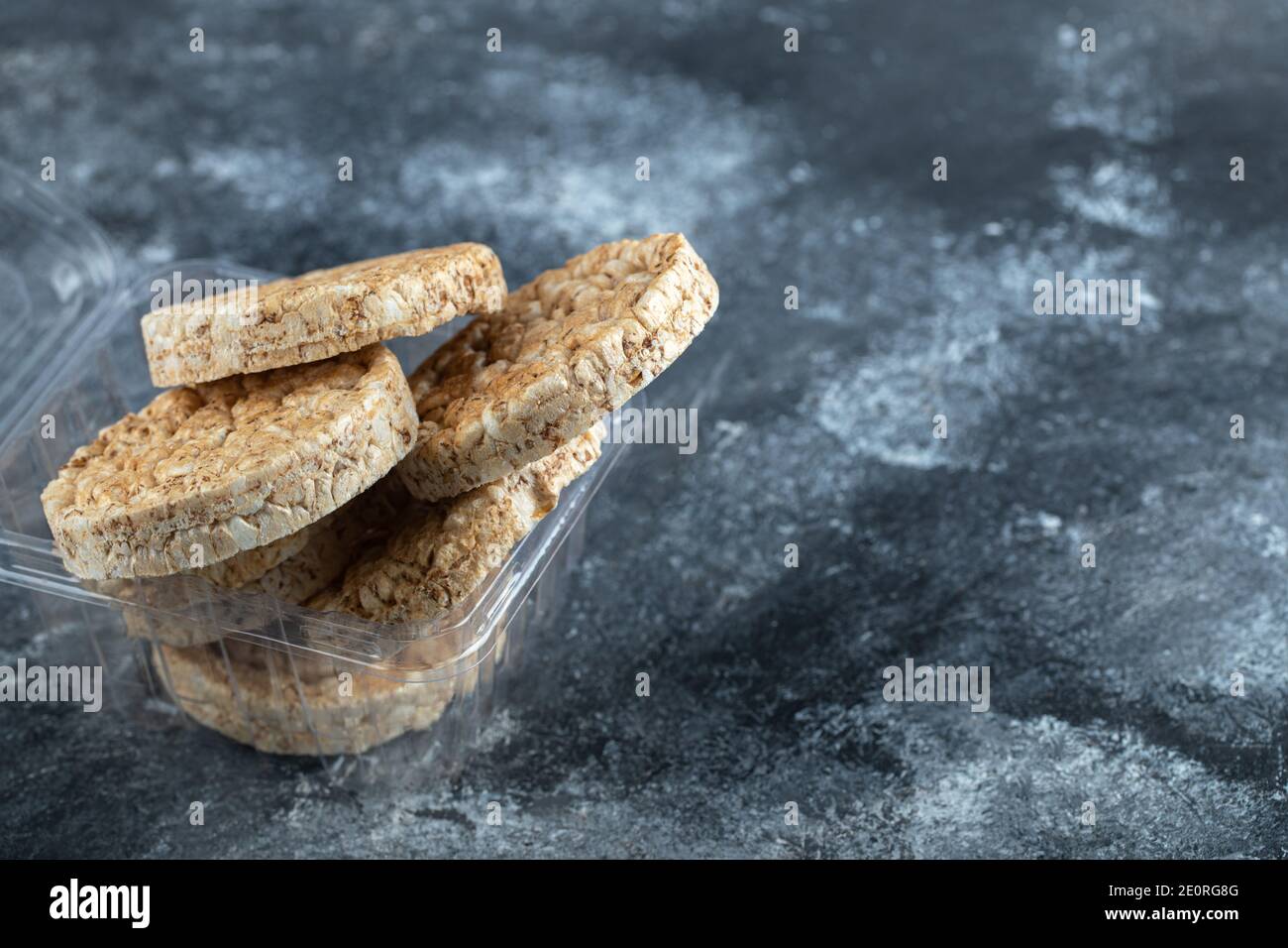 Pile of tasty crispbread in plastic container Stock Photo - Alamy