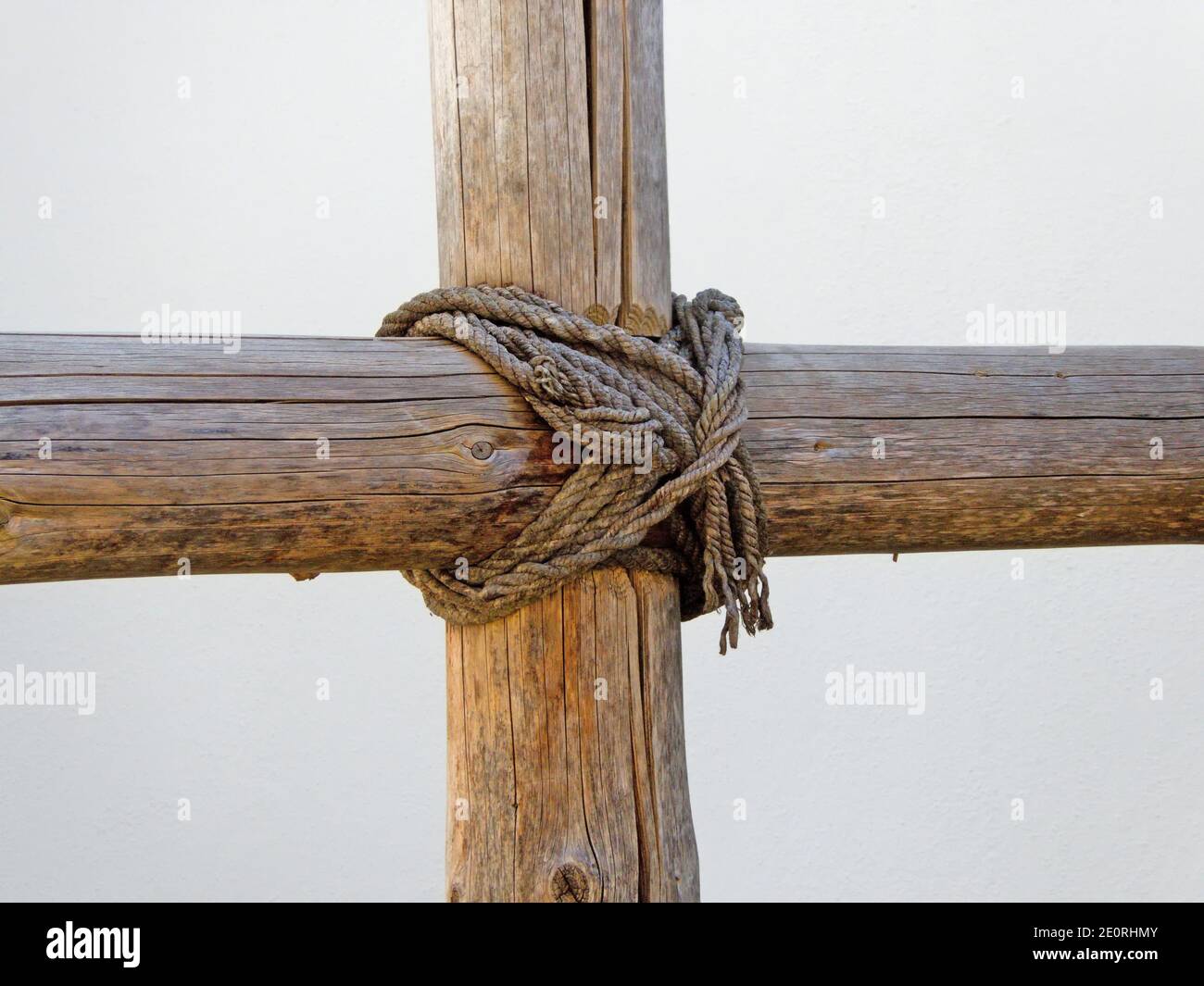 Wooden Cross Fixed With Hemp Rope Stock Photo - Alamy