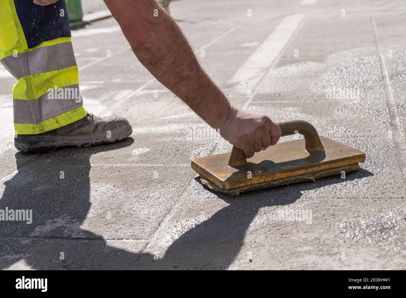 Road Workers With Tiler Tools At Work Stock Photo - Alamy