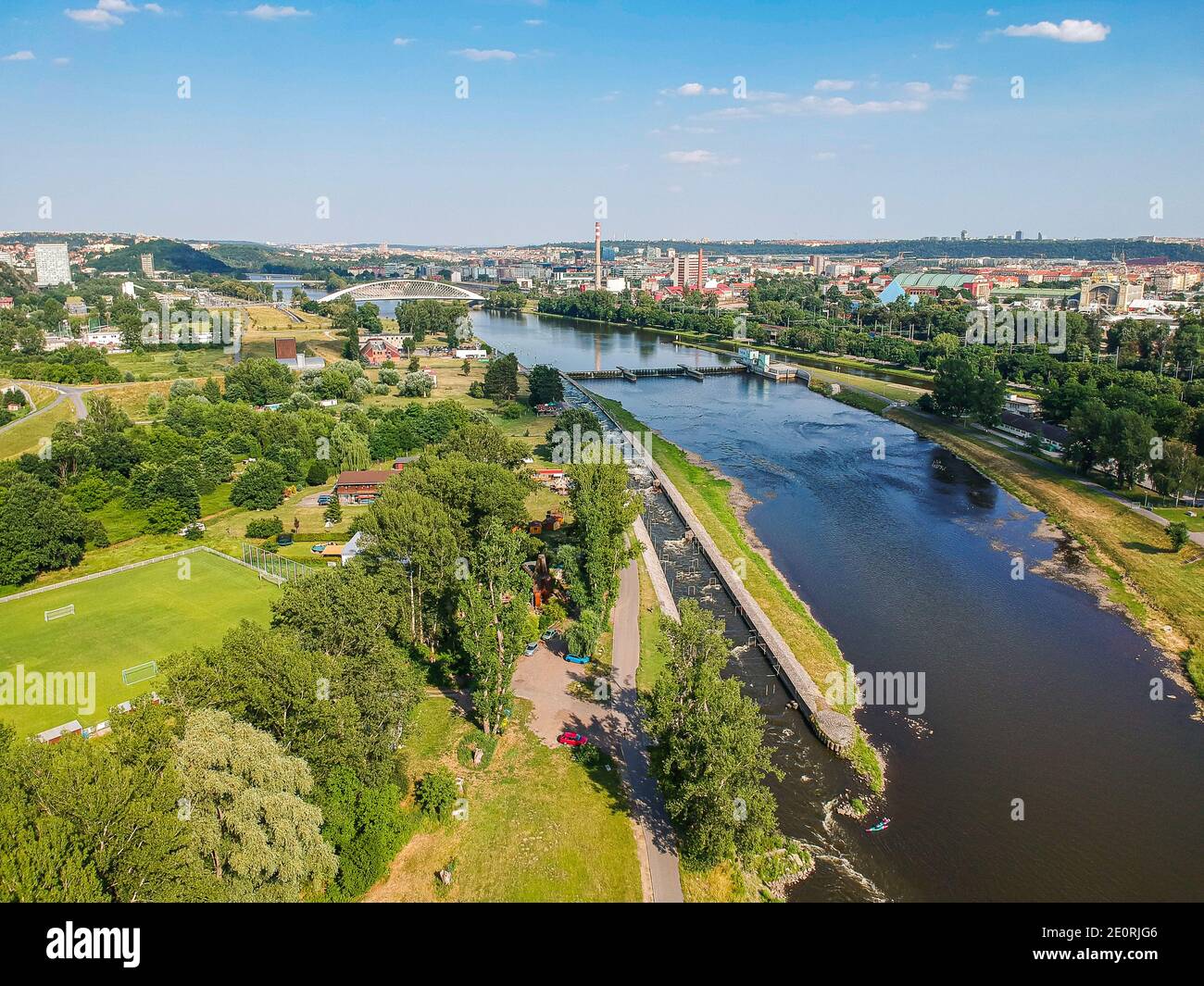 Moldau river in Troja area with architectonic bridge in background ...