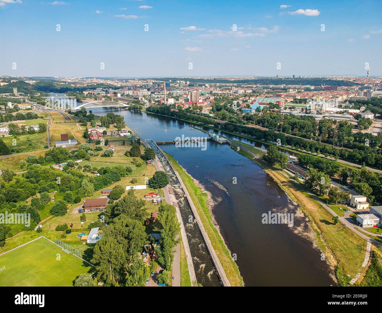 Moldau river in Troja area with architectonic bridge in background ...