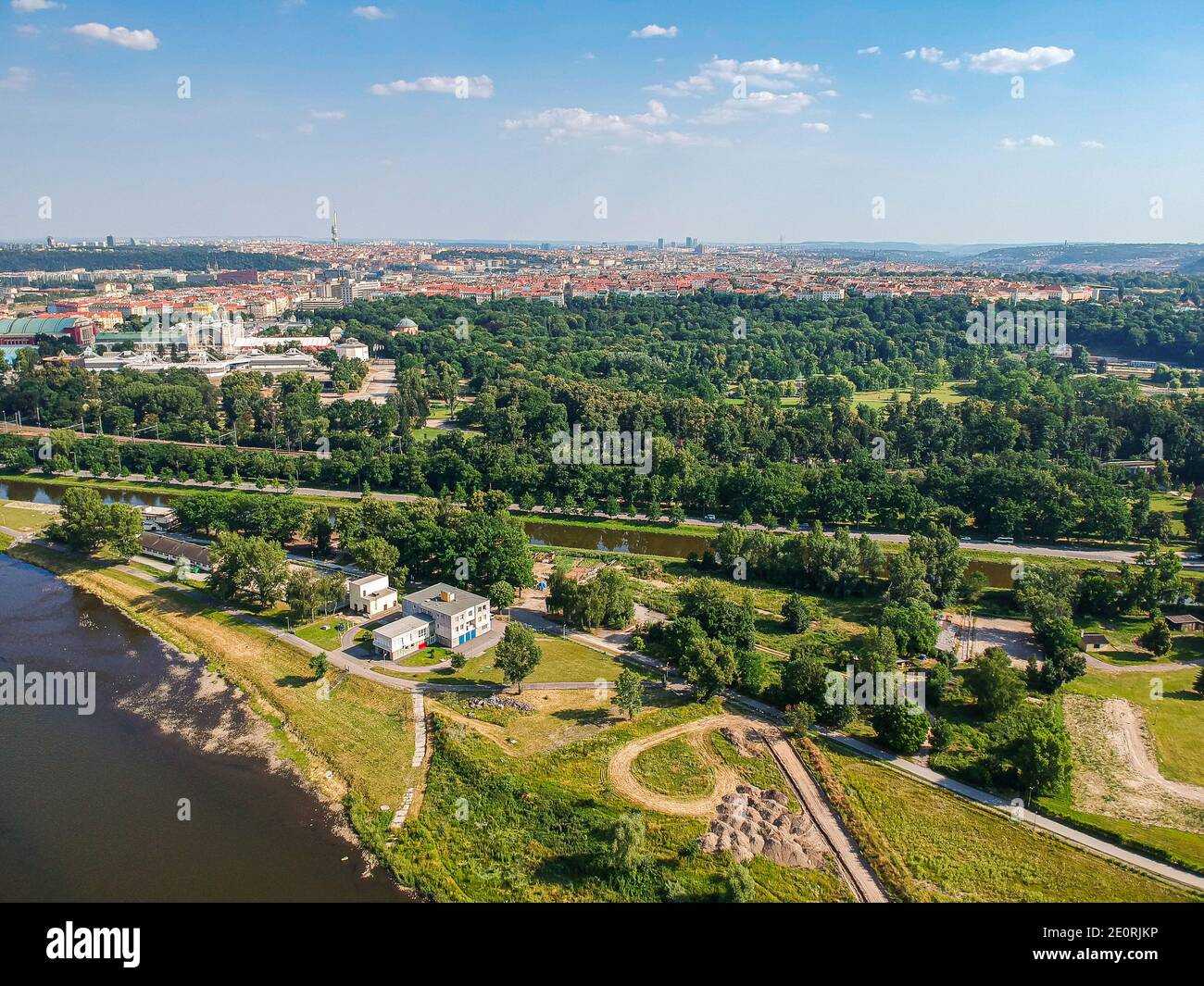 Aerial view of Stromovka park from river Vltava with urban part of ...