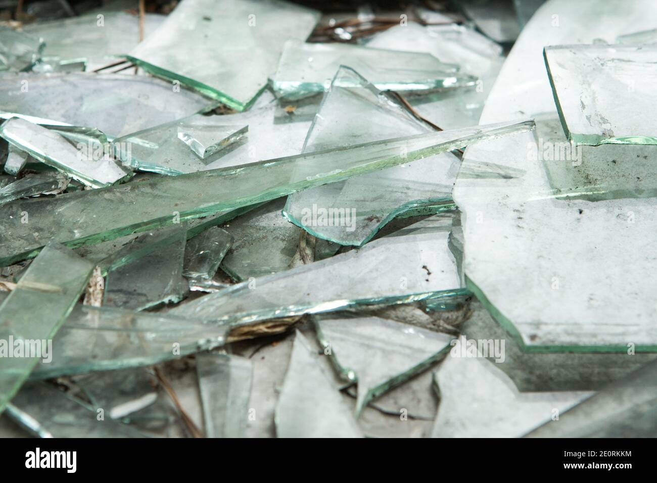 A shattered window on the ground. Broken glass background. Shards Stock ...