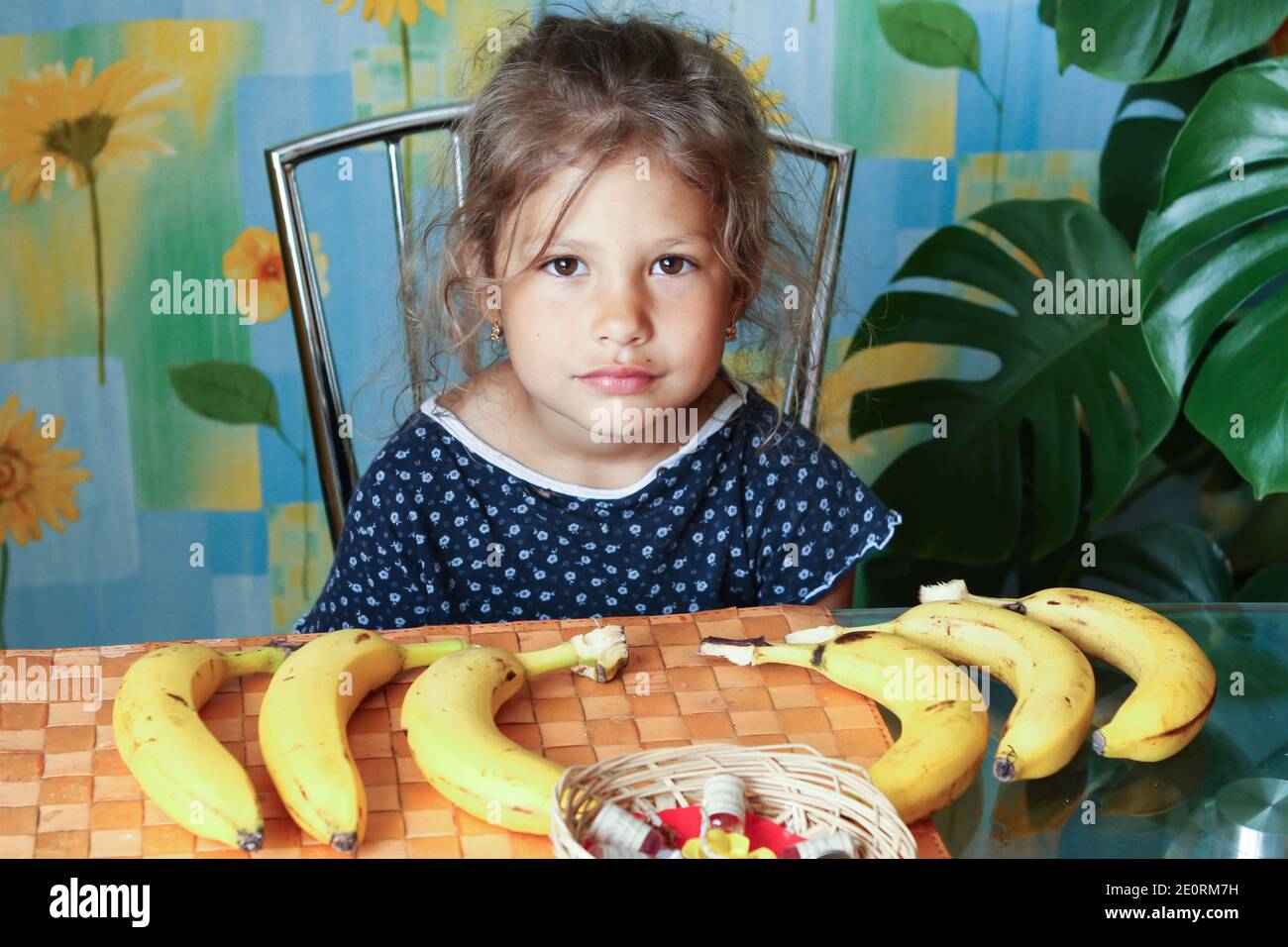 A small blonde girl looks thoughtfully into the distance Stock Photo ...