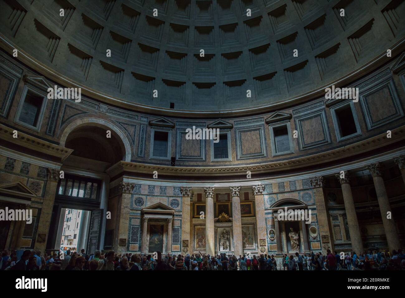 Tourists inside the Pantheon in Rome. People visiting and walking ...