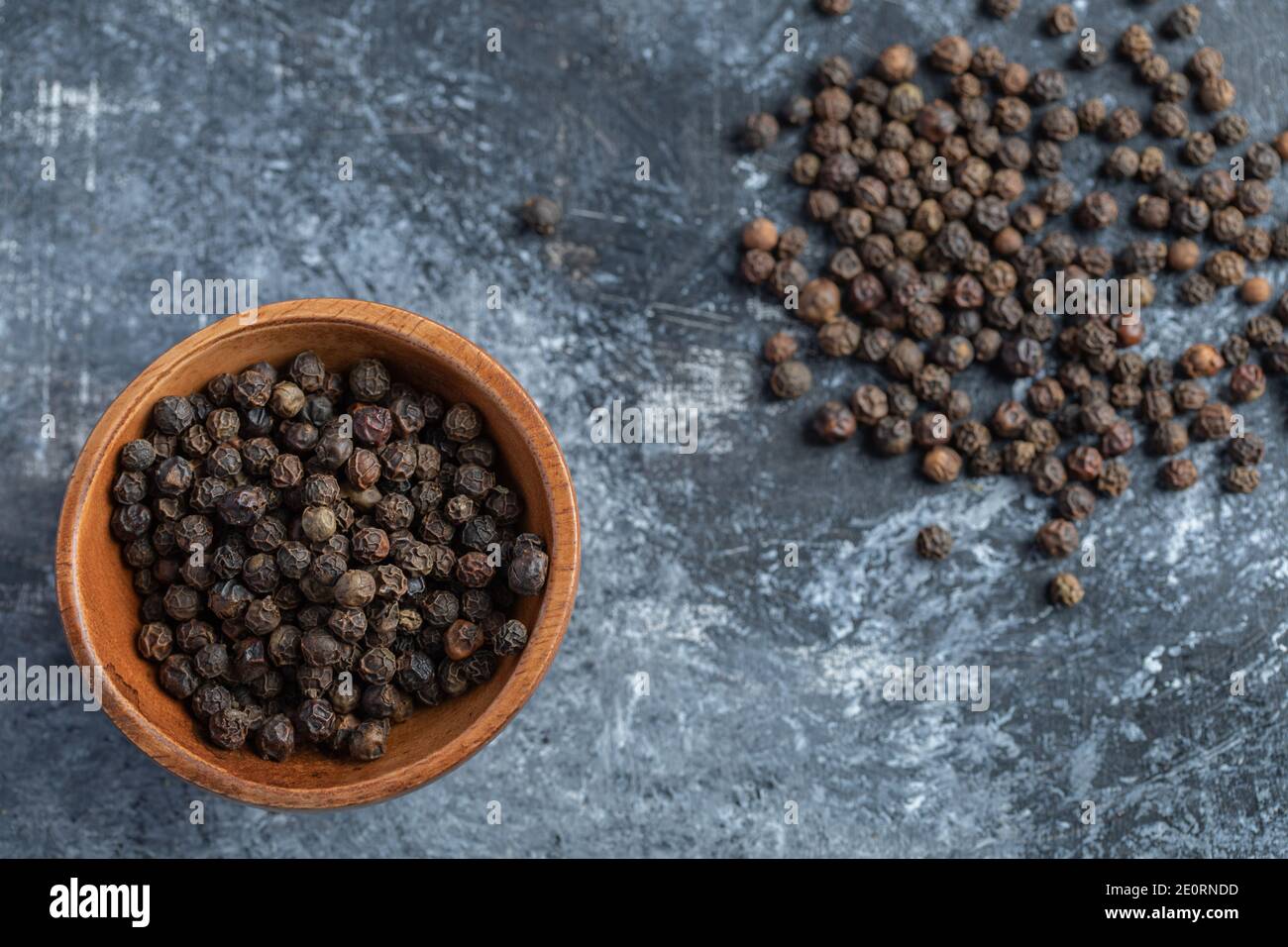 Pile of pepper grains on marble background Stock Photo - Alamy