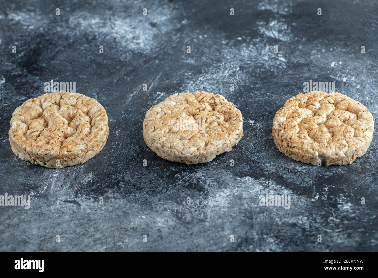 Three round crispbread on marble background Stock Photo - Alamy