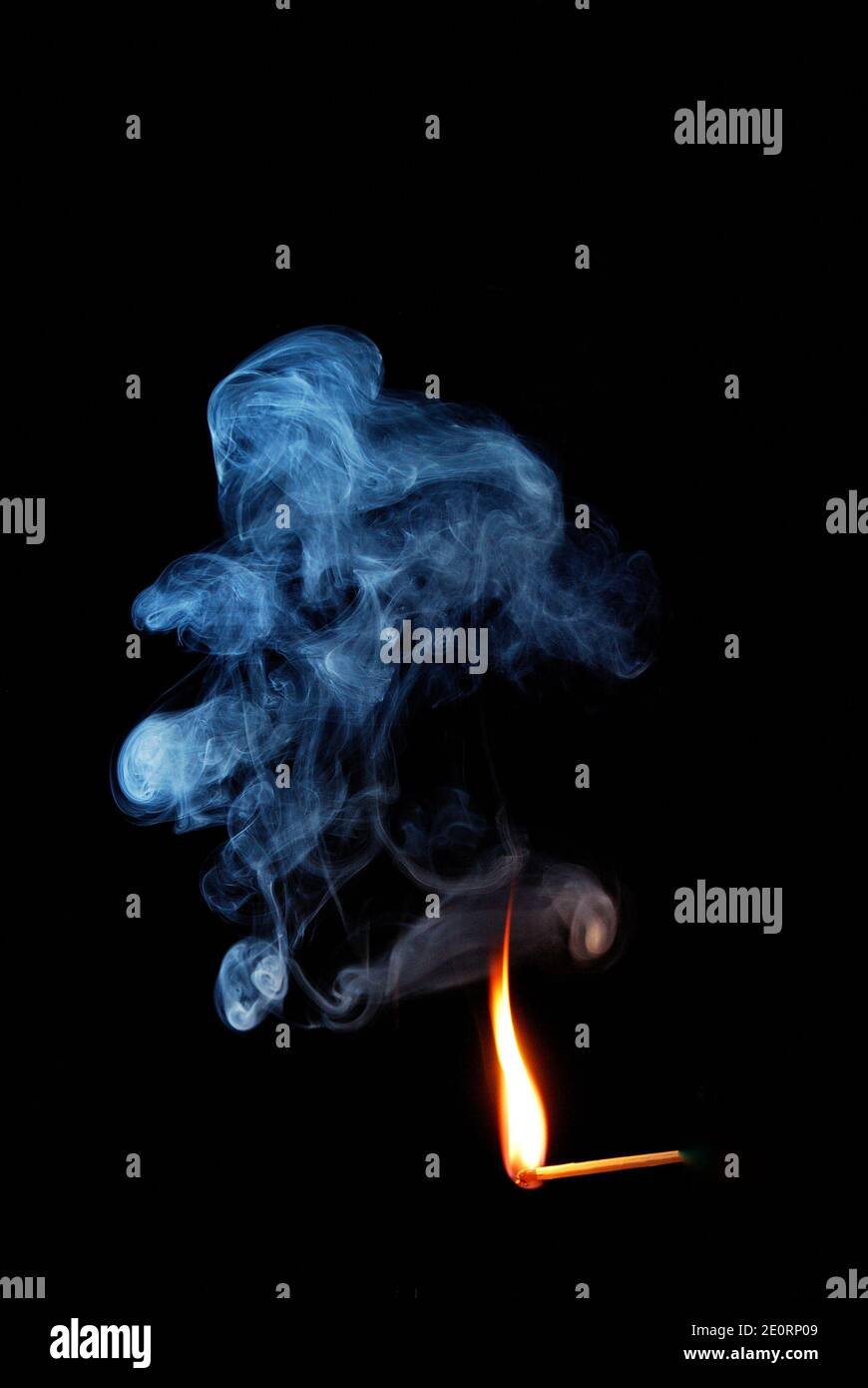 turned blue gray smoke with flame of match with black background Stock ...