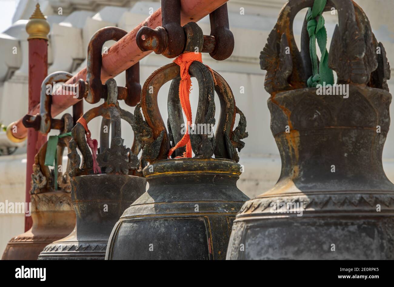 Ancient bells hanging on pillars outside in the thai temple. Thai ...