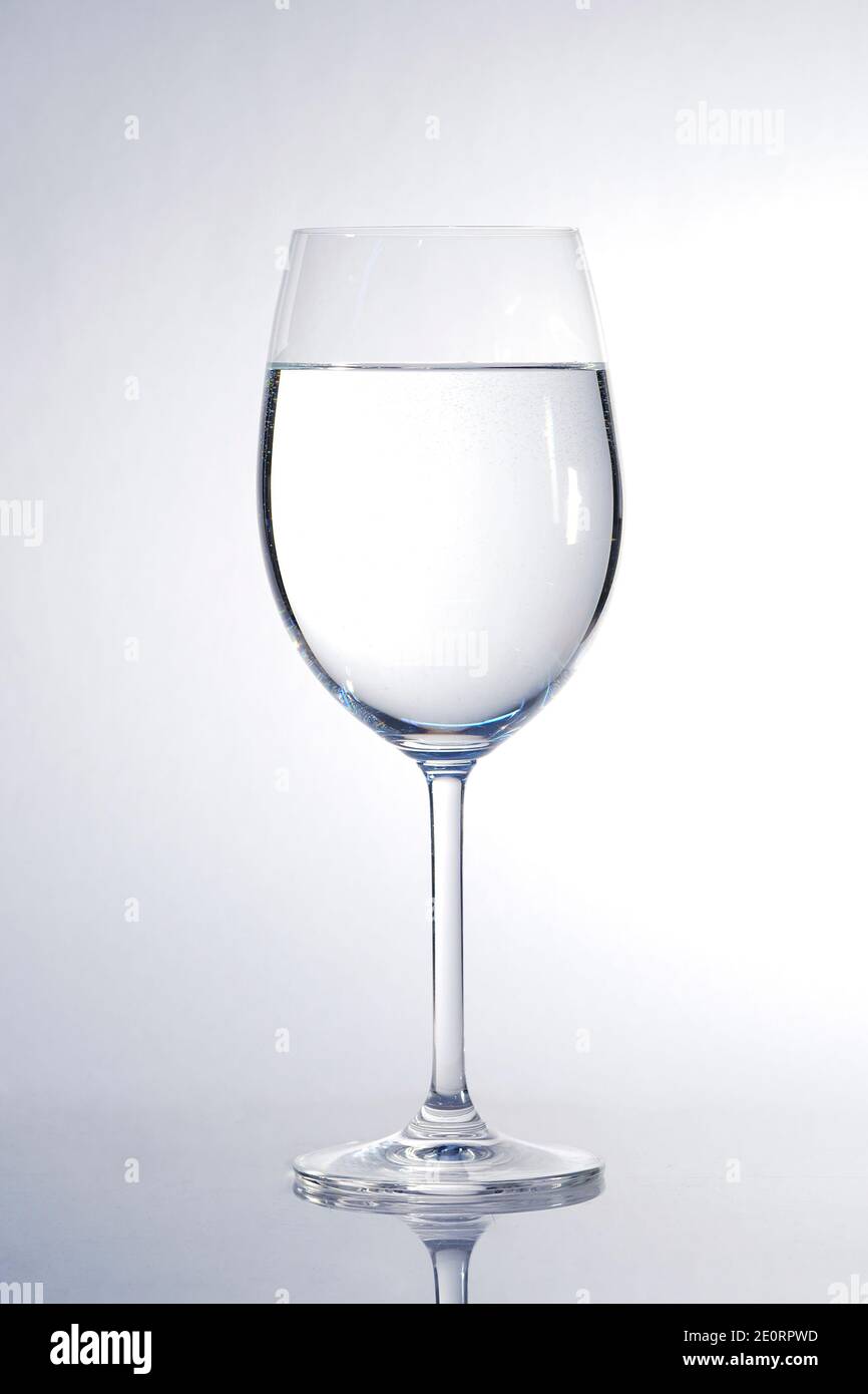 clear water glass in portrait view Stock Photo - Alamy