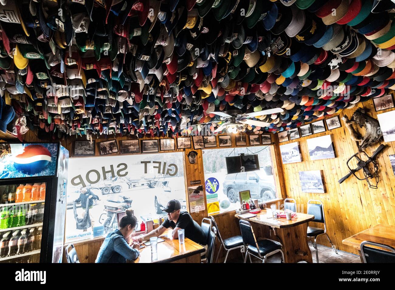 Some of the more than 11,000 hats on display at the Toad River Lodge ...