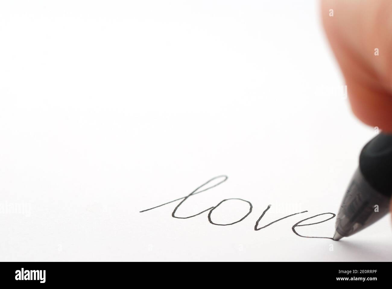 the word love written on a white letter Stock Photo - Alamy