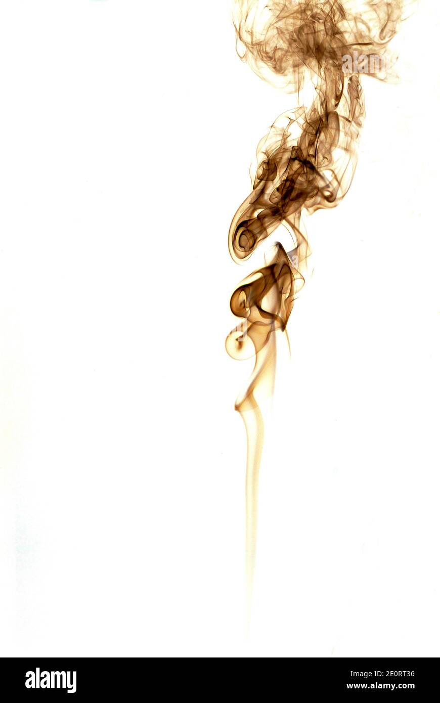 turned brown smoke on white background portrait format Stock Photo - Alamy