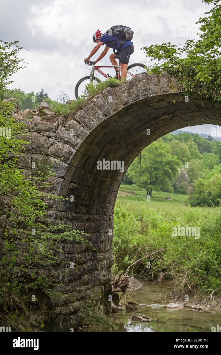 Cross An Old Narrow Arch Bridge By Mountain Bike Stock Photo - Alamy