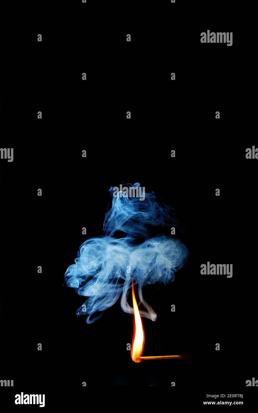 little smoke with bright flame on black background Stock Photo - Alamy